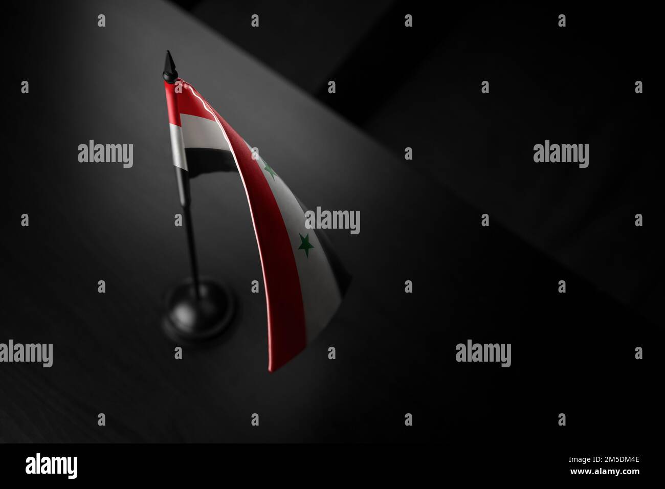 Small national flag of the Syria on a black background Stock Photo - Alamy