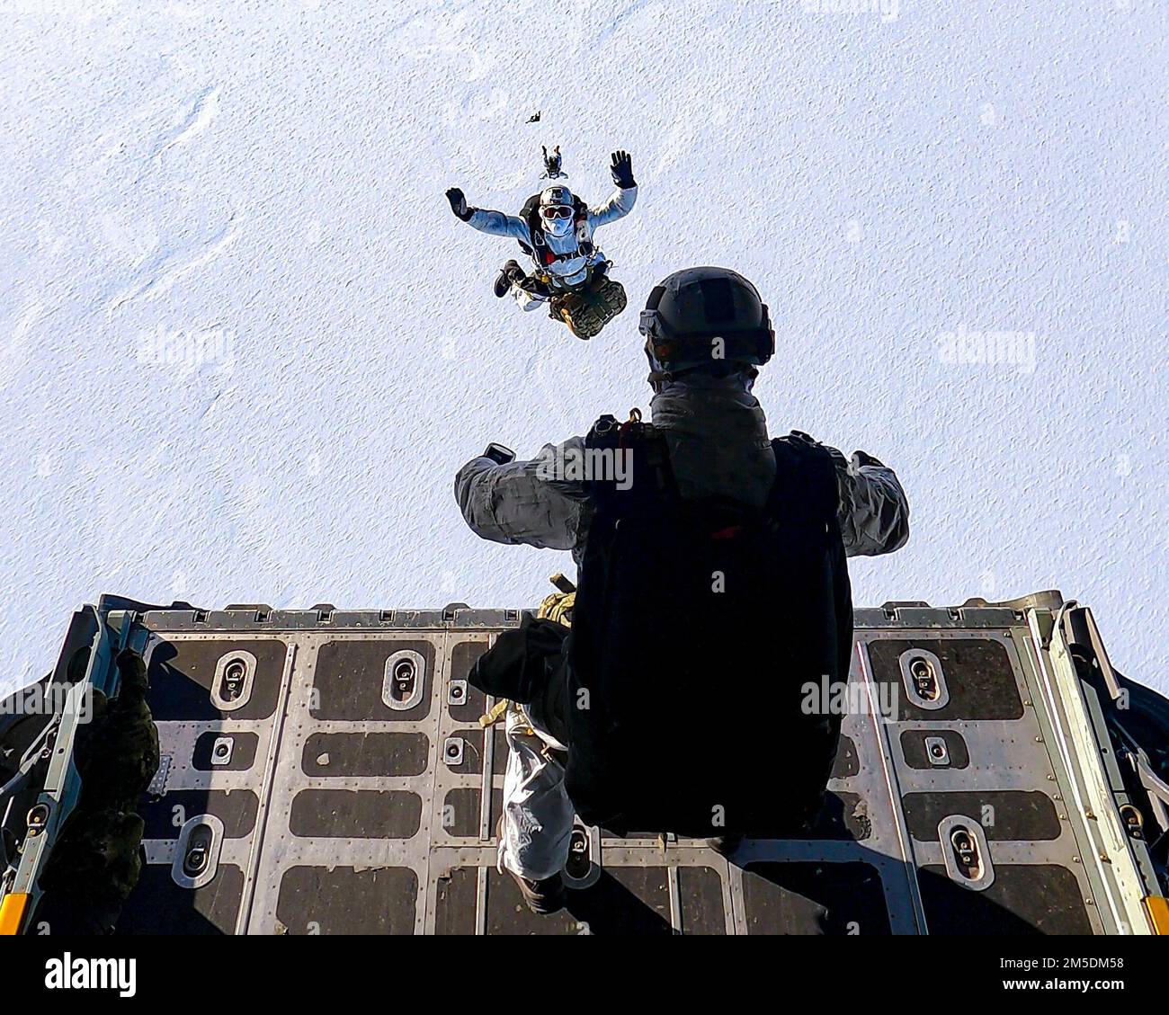 Naval Special Warfare members performs a high-altitude low-opening jump ...