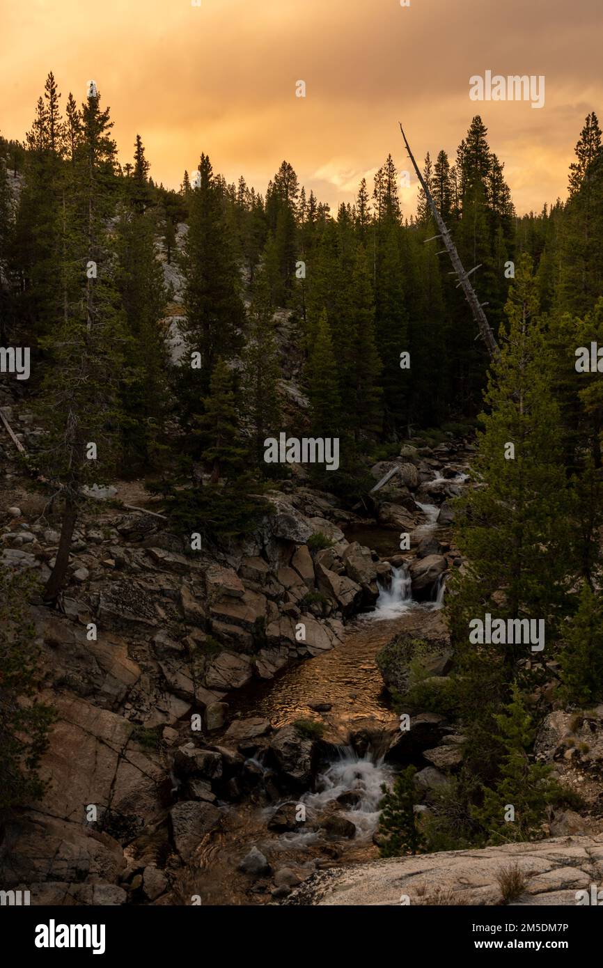 Orange Skies Over Stream Flowing into the Glen Aulin Campground in ...