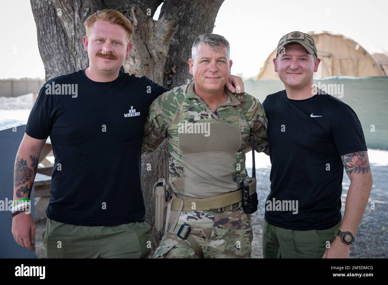 Staff Sgt. Daniel Fisher stands with two of his sons, Spc. Caleb and ...