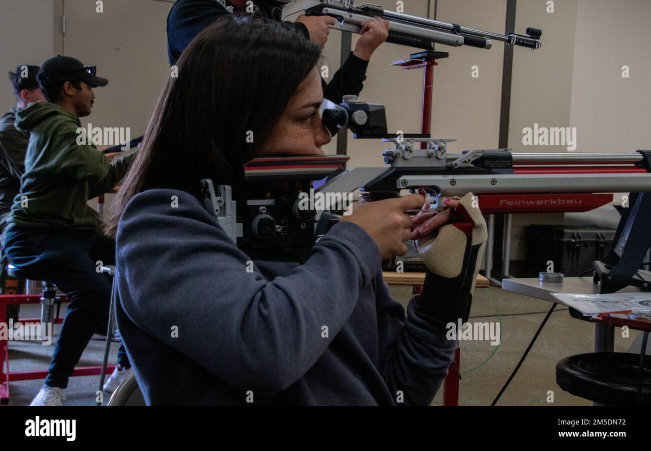 Retired U.S. Marine Corps Lance Cpl. Annika Hutsler fires a Feinwerkbau ...