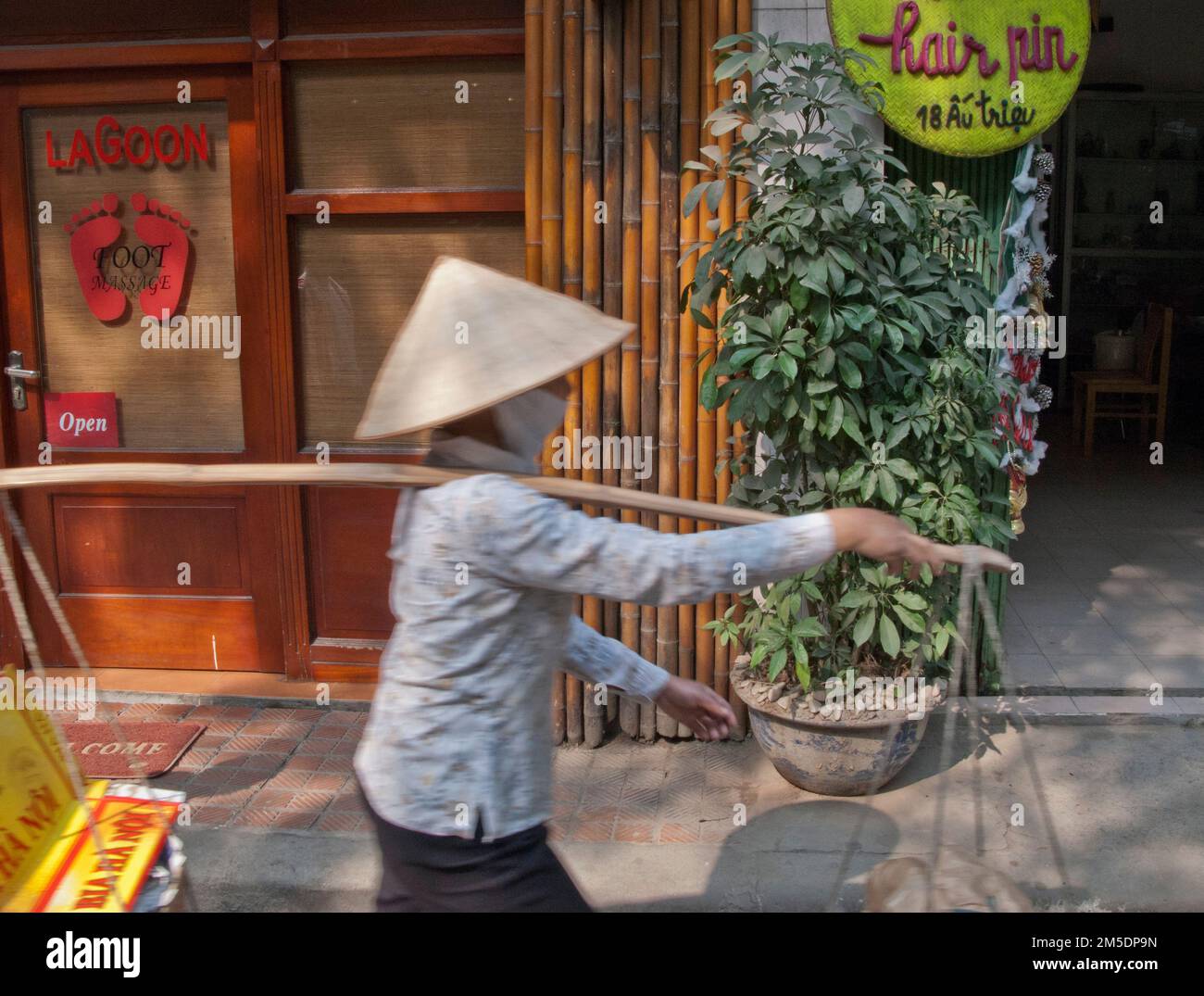 Farmer carry,goods on a pail in basket ,in the streets of Hanoi,Vietnam ...