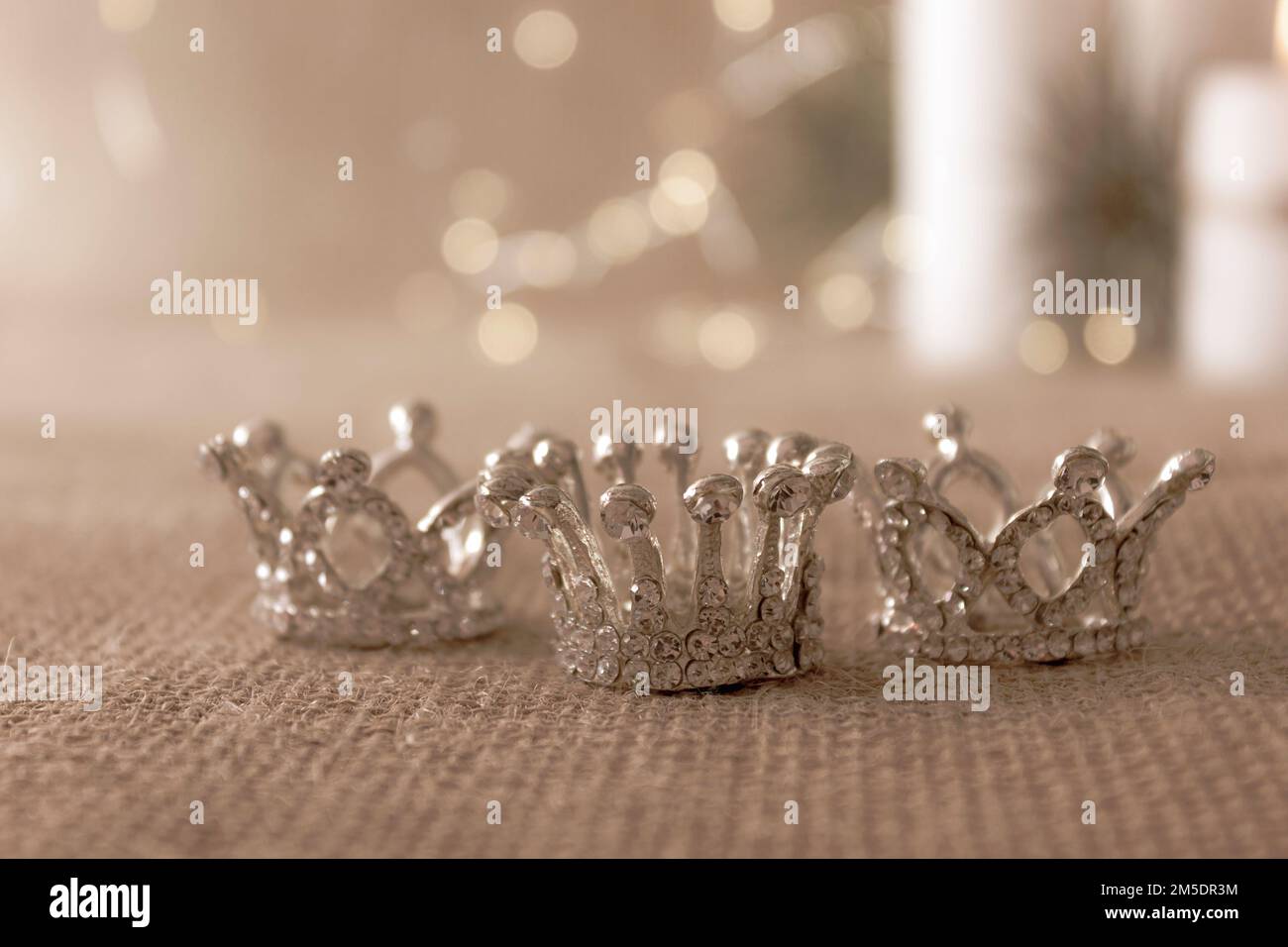 Happy Epiphany day concept. Three silver crowns, symbol of Tres Reyes ...