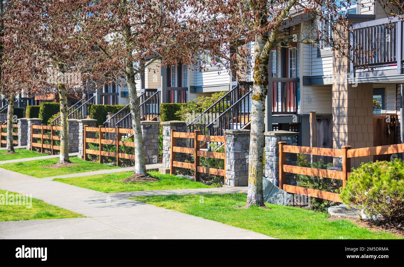 Wooden front yard fence and entrnace of residential townhouses Stock ...