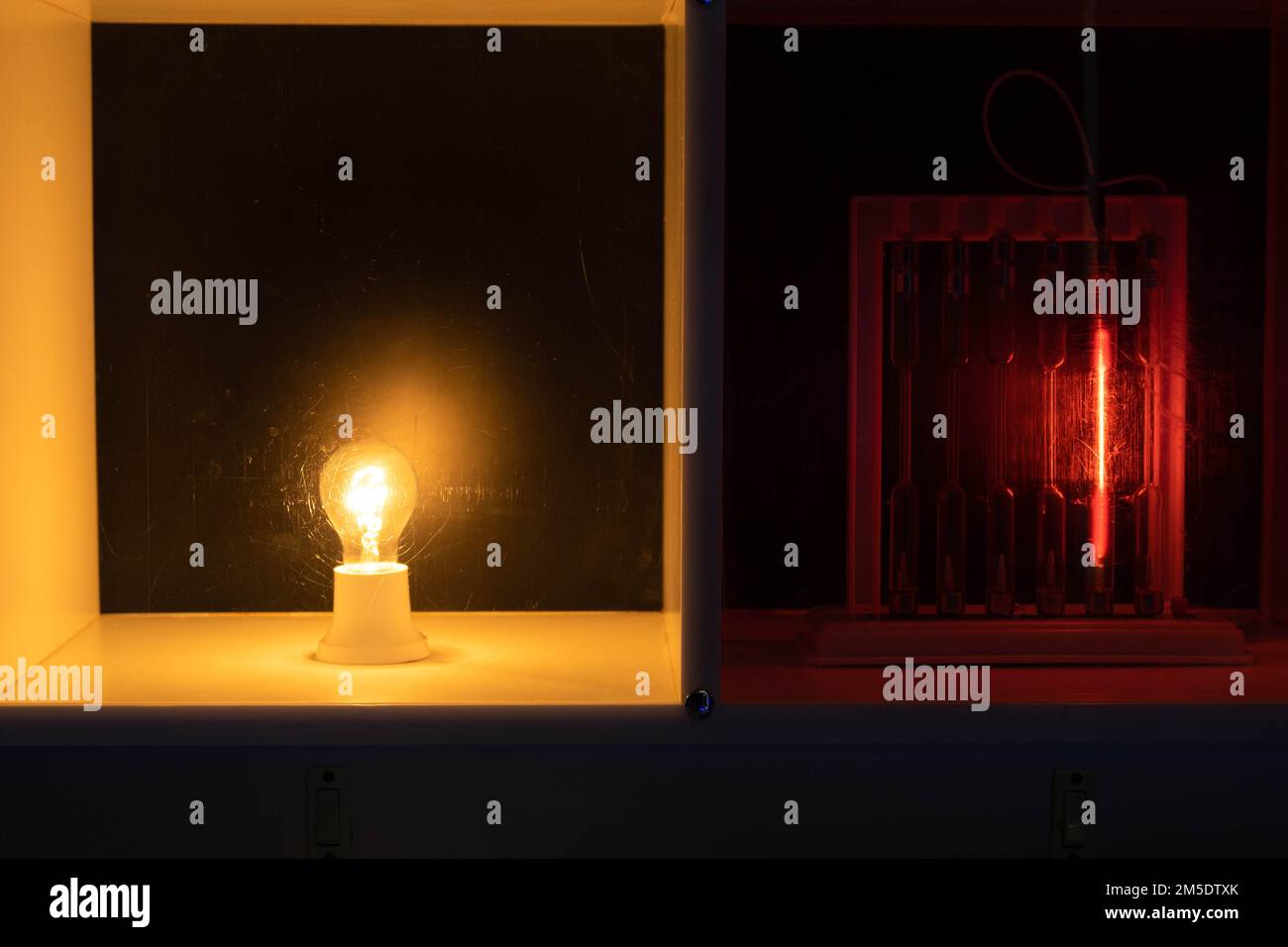 light bulb in white box on black background Stock Photo - Alamy