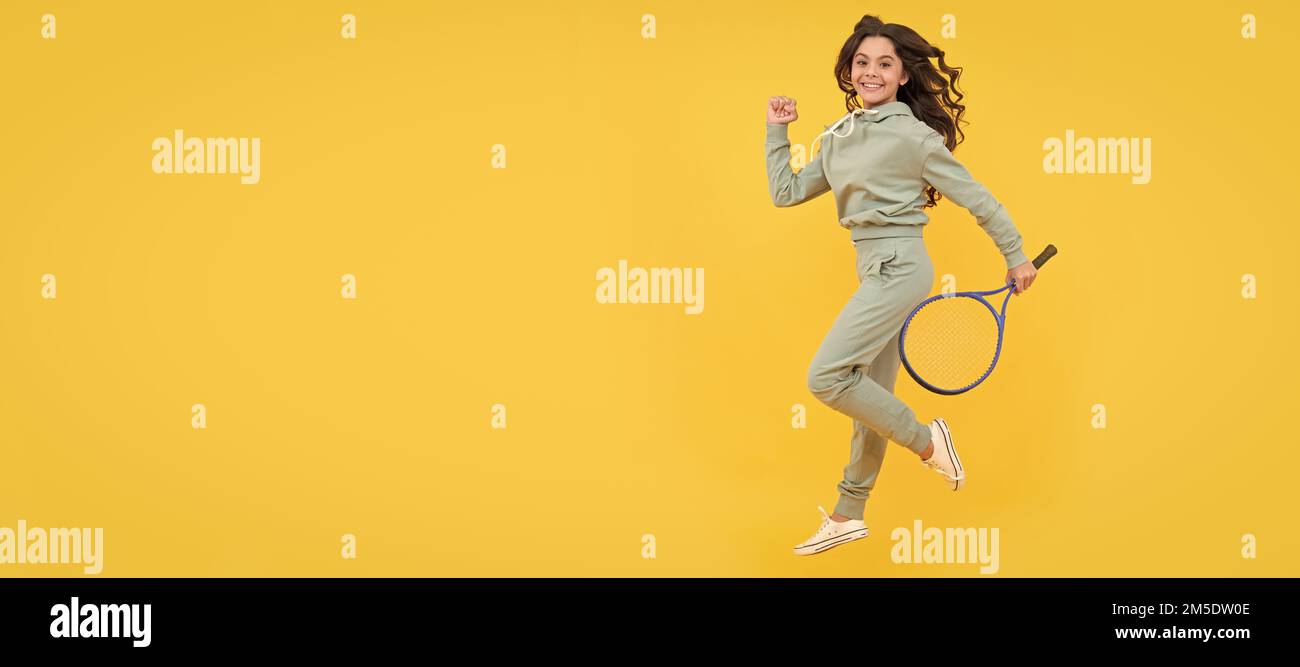 happy energetic kid jump in sportswear with squash racquet running to ...