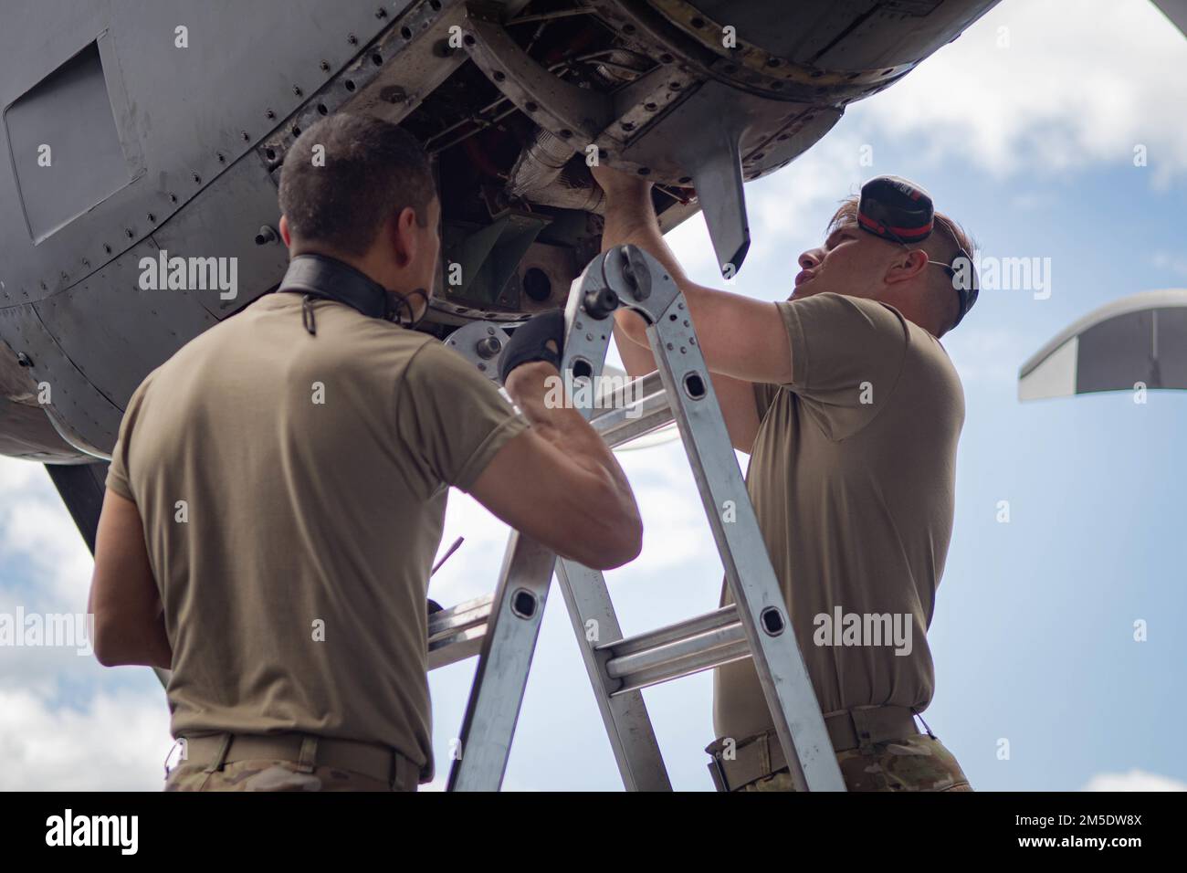 Airmen from the 152nd Maintenance Group inspect the engine of a Nevada ...
