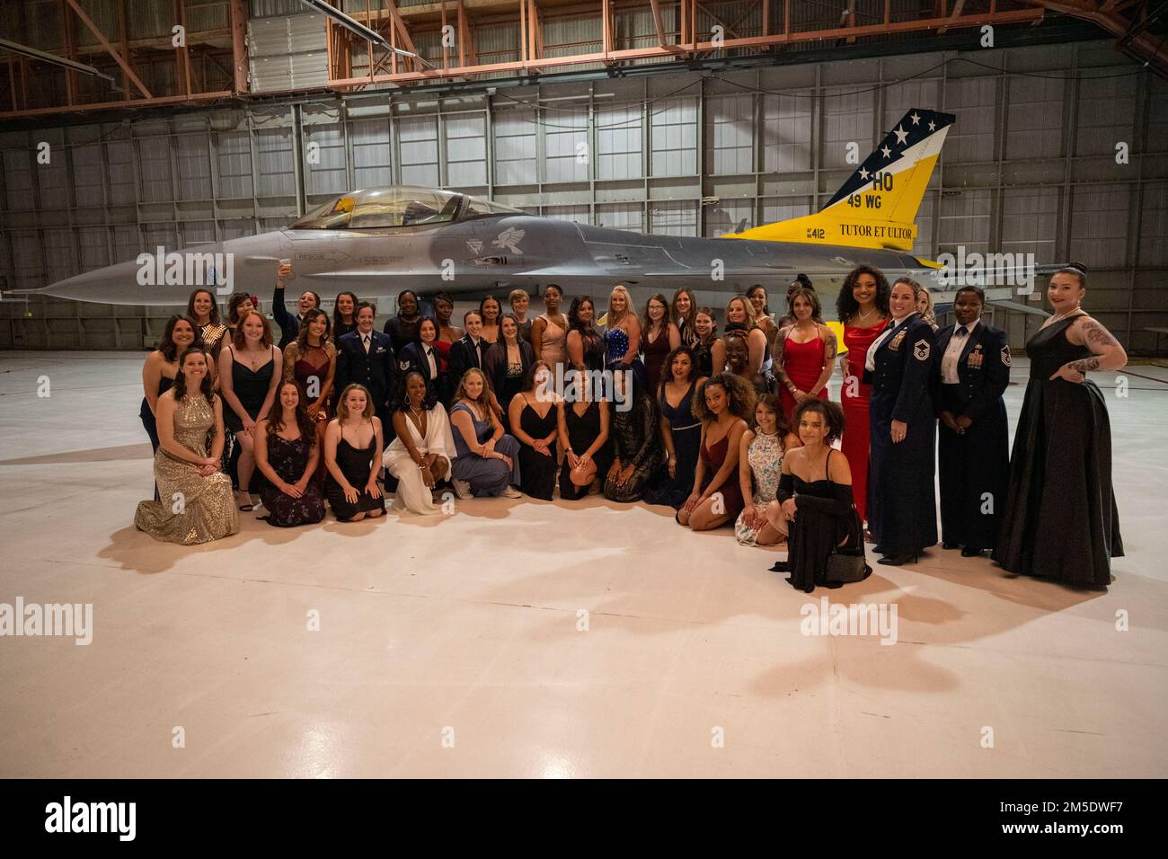 Active duty Airmen pose in front of the 49th Wing F-16 Viper flagship ...