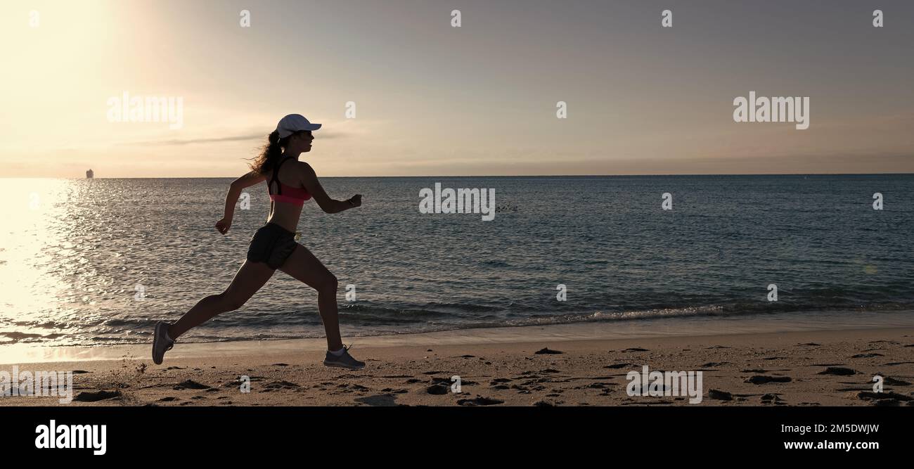 Woman run and jump on sea beach. Running is my favorite. Fit girl run ...