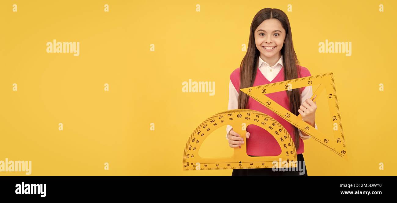 cheerful teen girl study math with protractor and triangle measuring ...