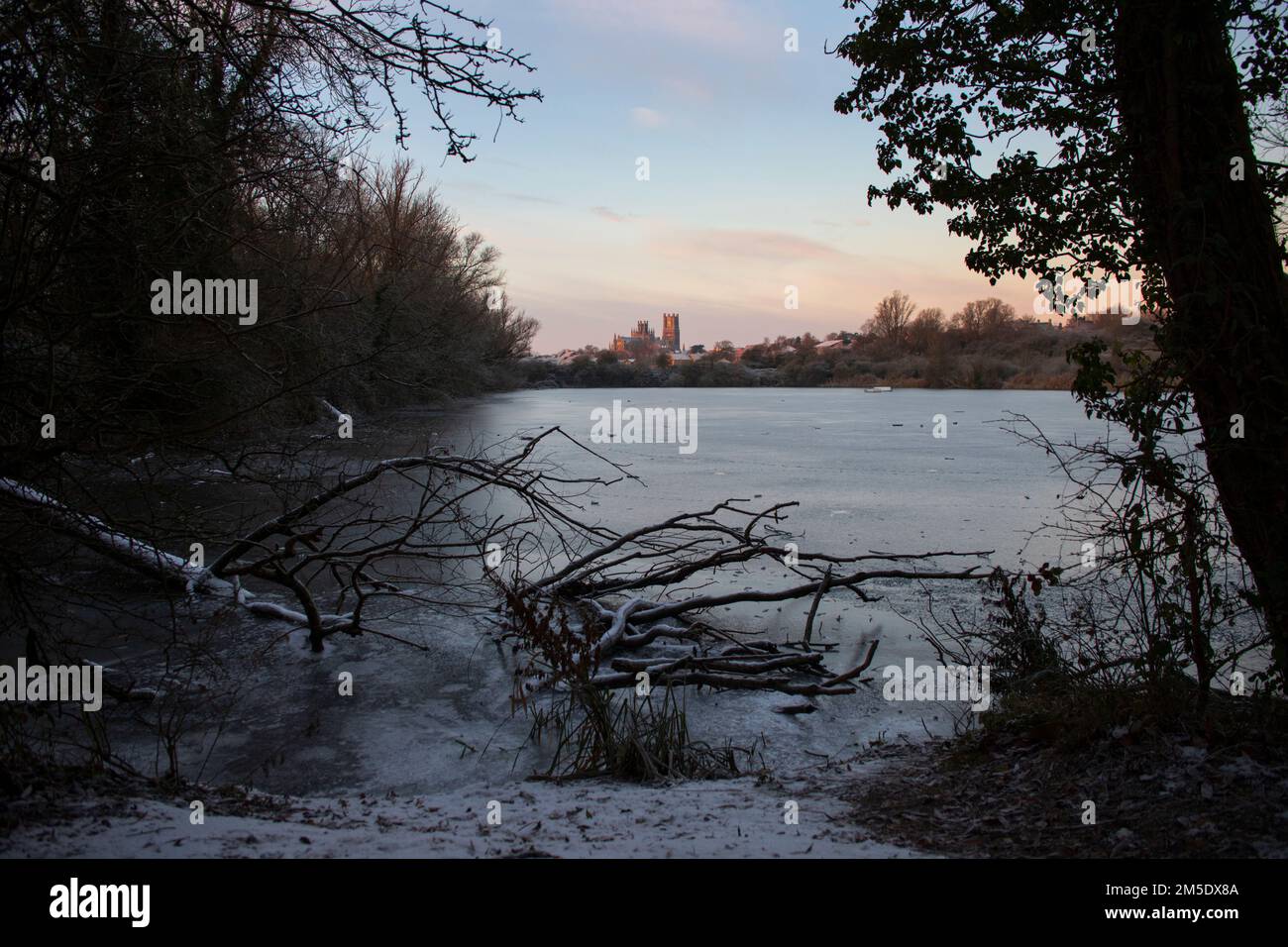 Ely Cathedral and a frozen Roswell Pits, on a cold frosty morning, Ely ...