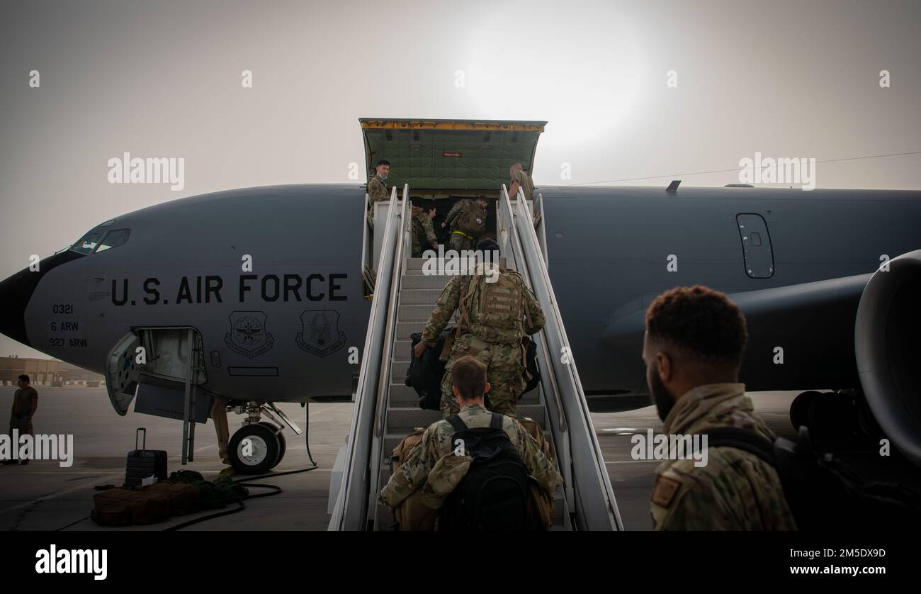 U.S. Airmen assigned to the 379th Air Expeditionary Wing board a KC-135 ...