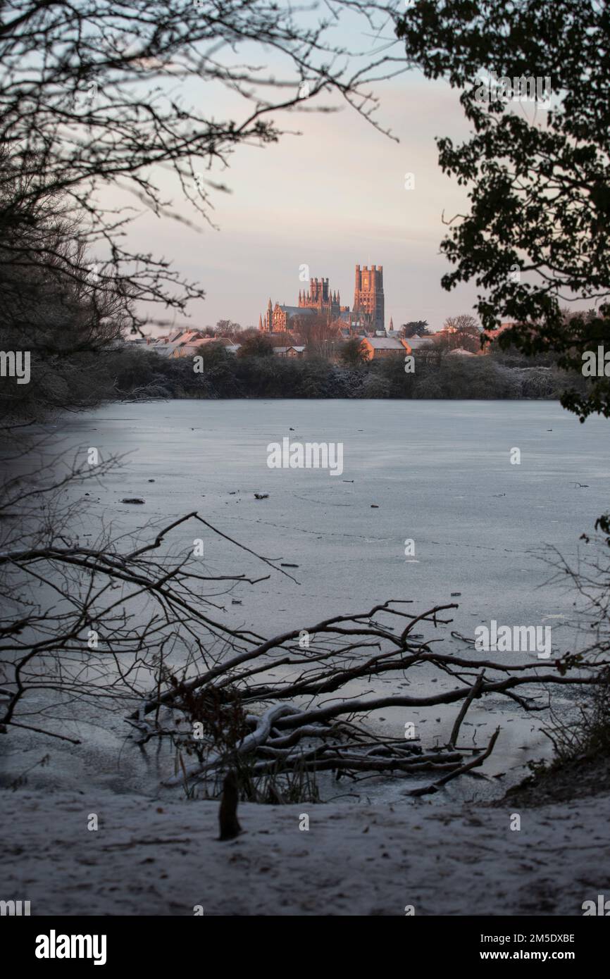 Ely Cathedral and a frozen Roswell Pits, on a cold frosty morning, Ely ...