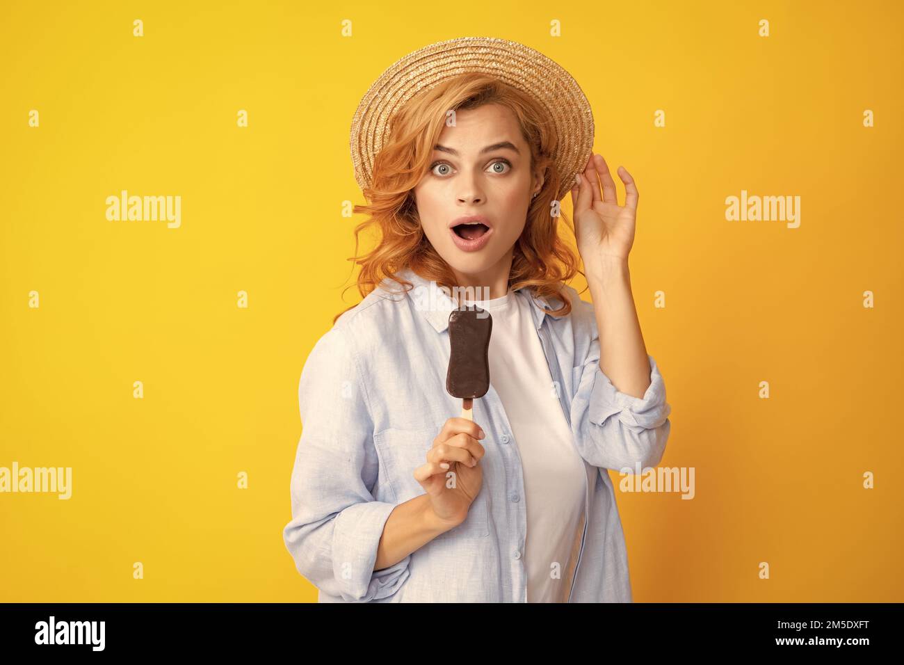Fashion portrait cool young woman with ice cream over yellow background ...