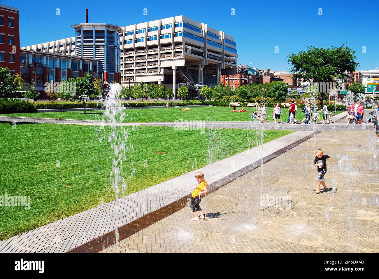 Children play in the fountains of the Rose Kennedy Greenway in Boston ...