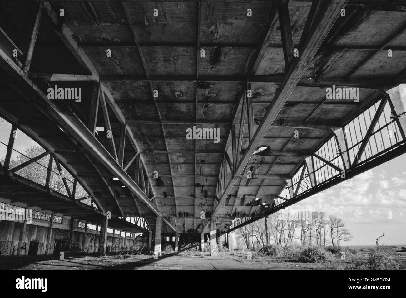 Old arched metal structures abandoned air hangar Stock Photo - Alamy