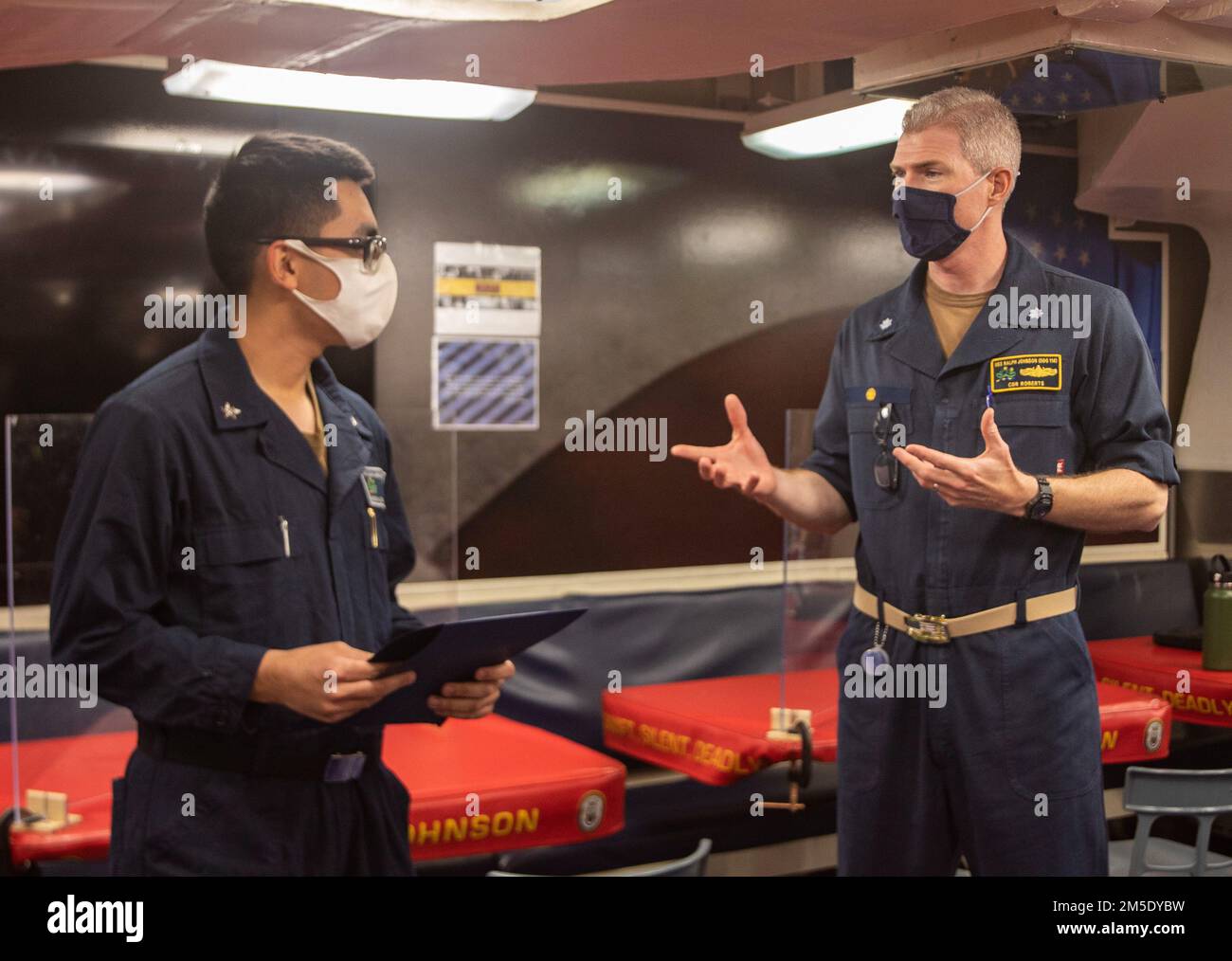PHILIPPINE SEA (March 5, 2022) Cmdr. Colin Roberts (right), from Lake ...