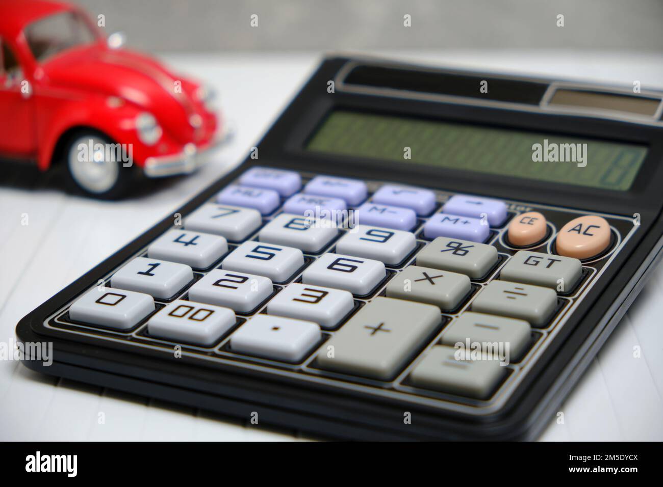 Calculator and car, concept of calculating cost of buying car Stock ...