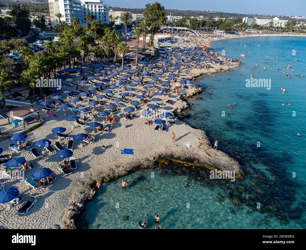 Aerial panoramic view on holidays villas and resorts and blue crystal ...