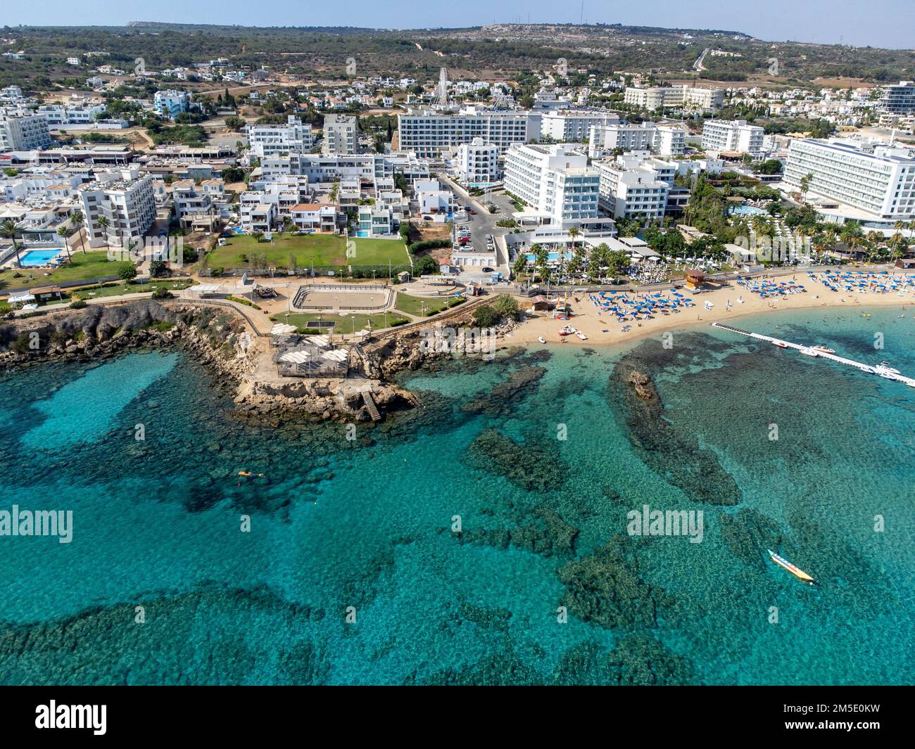 Aerial panoramic view on villas and holidays resorts and blue crystal ...