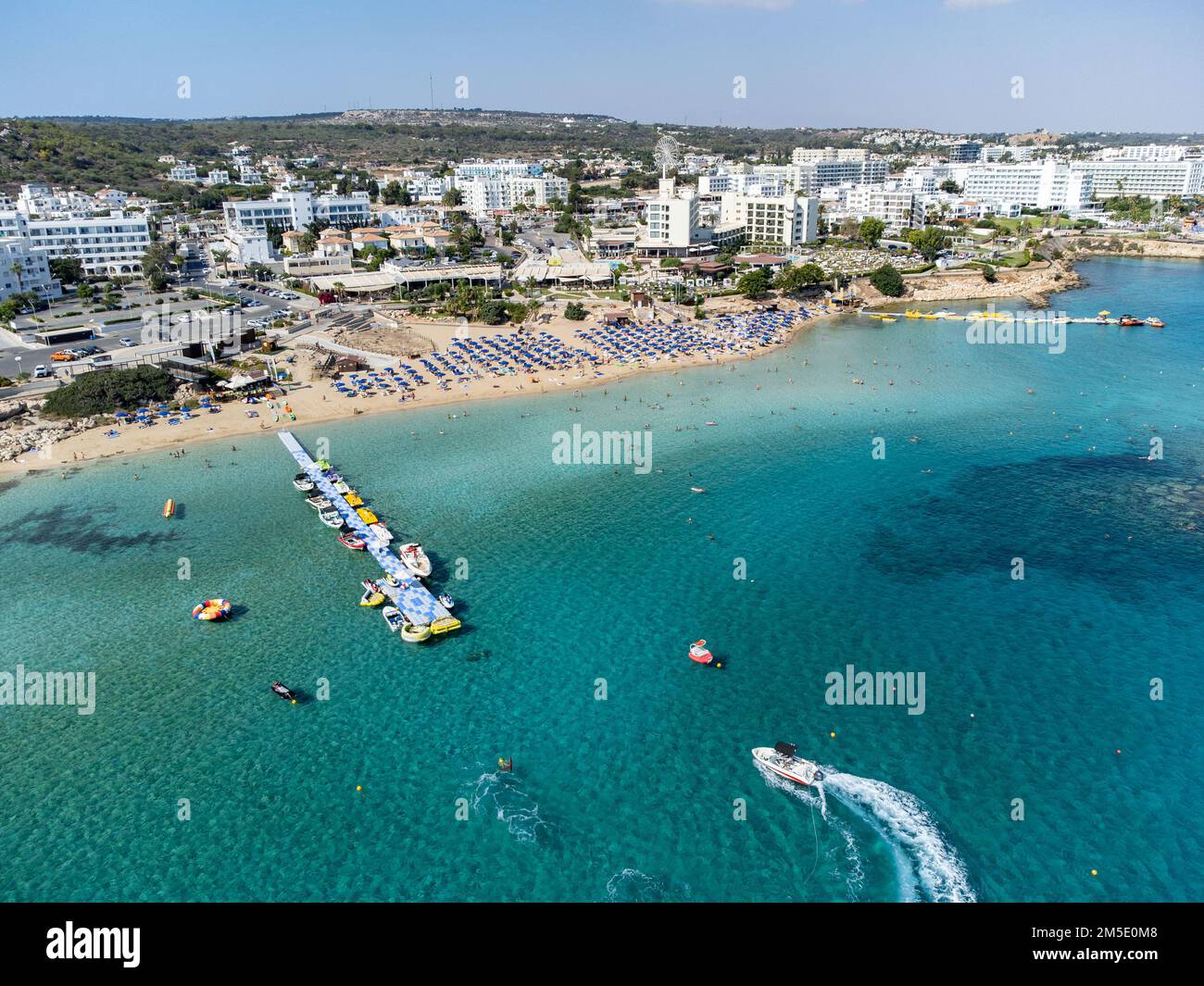 Aerial panoramic view on villas and holidays resorts and blue crystal ...