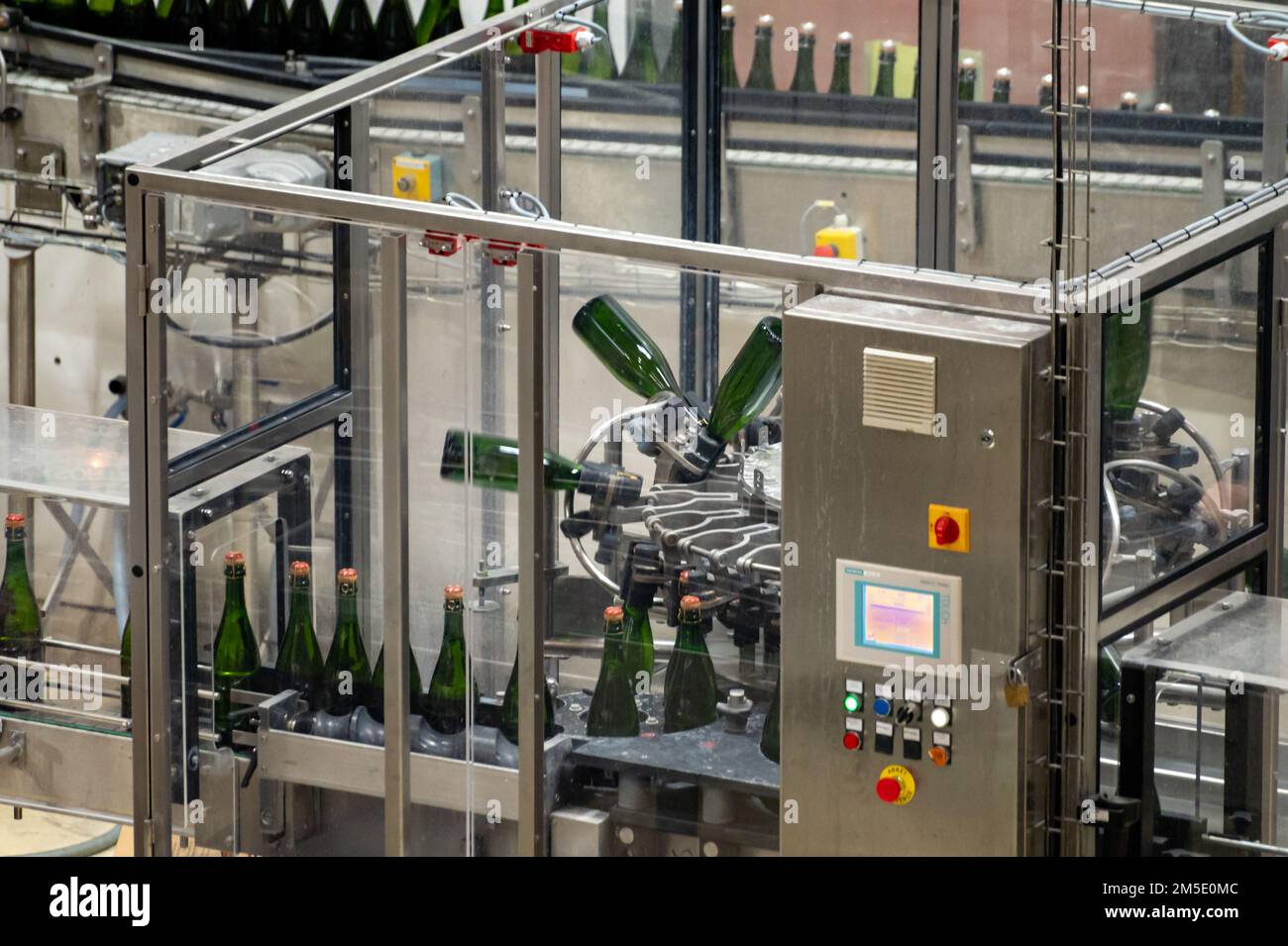 Production of cremant sparkling wine in Burgundy, France. Automatically ...