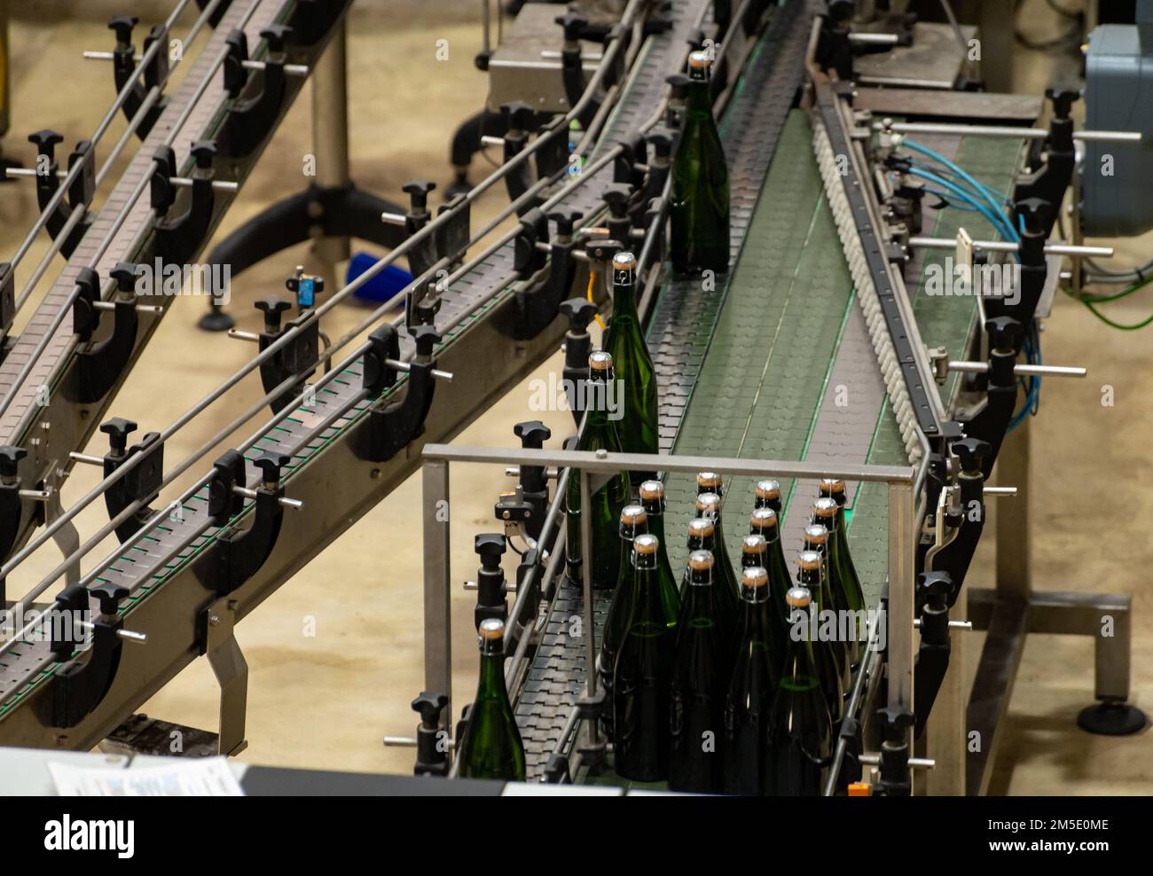 Production of cremant sparkling wine in Burgundy, France. Automatically ...
