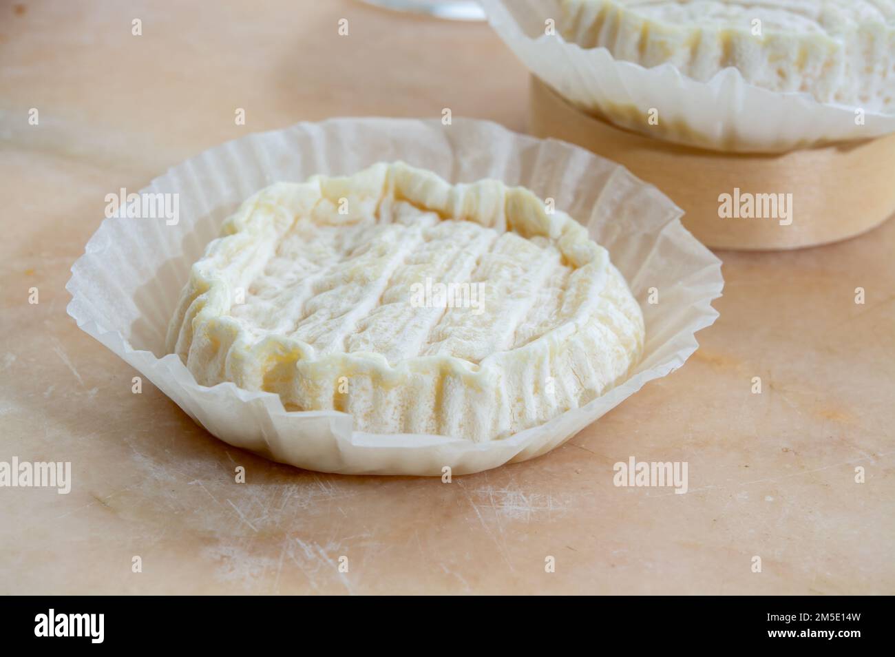French cheeses Rocamadour served on marble board close up Stock Photo ...