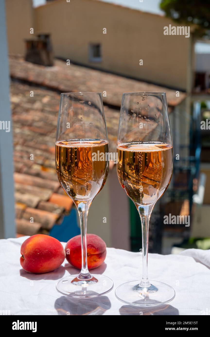 Summer party, drinking of French brut rose champagne sparkling wine in ...