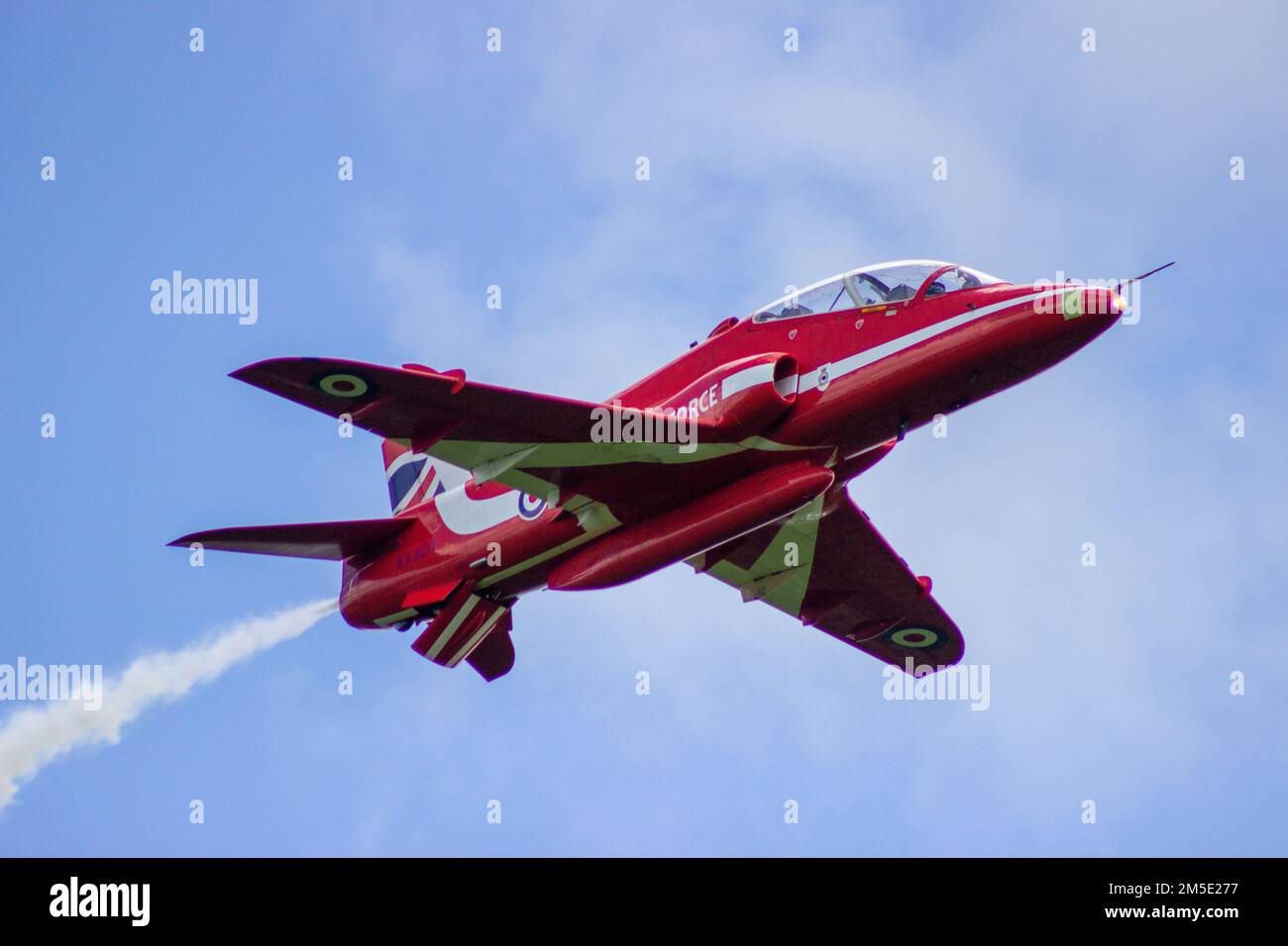 A red aircraft from the Cosford Air show in the blue sky Stock Photo ...