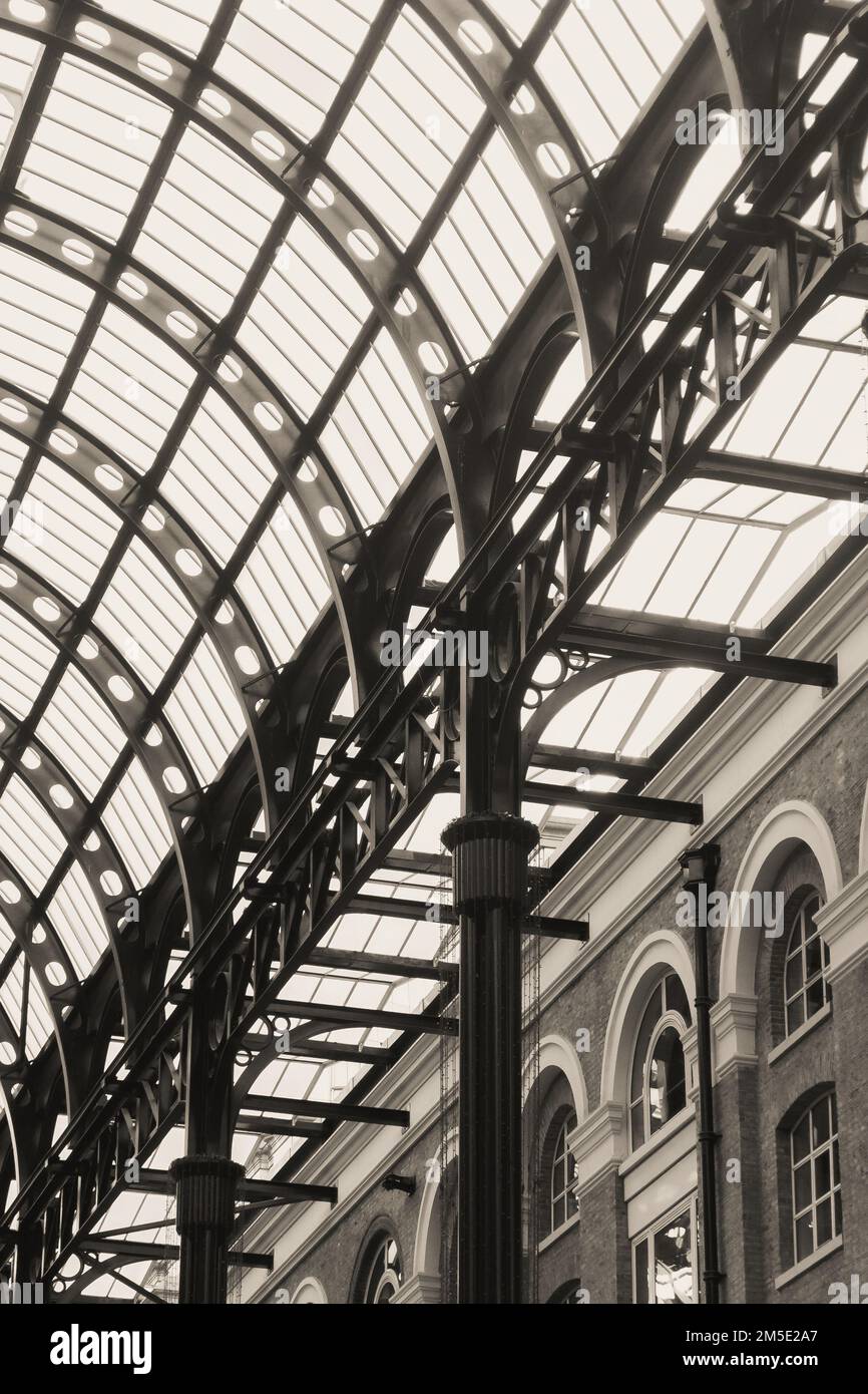 A grayscale of curving ceiling over arch facade windows at Hay's ...