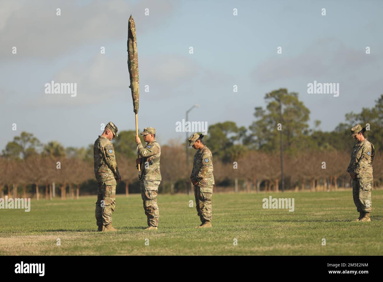 Col. David Key and Command Sgt. Maj. Denice Malave bow their heads ...