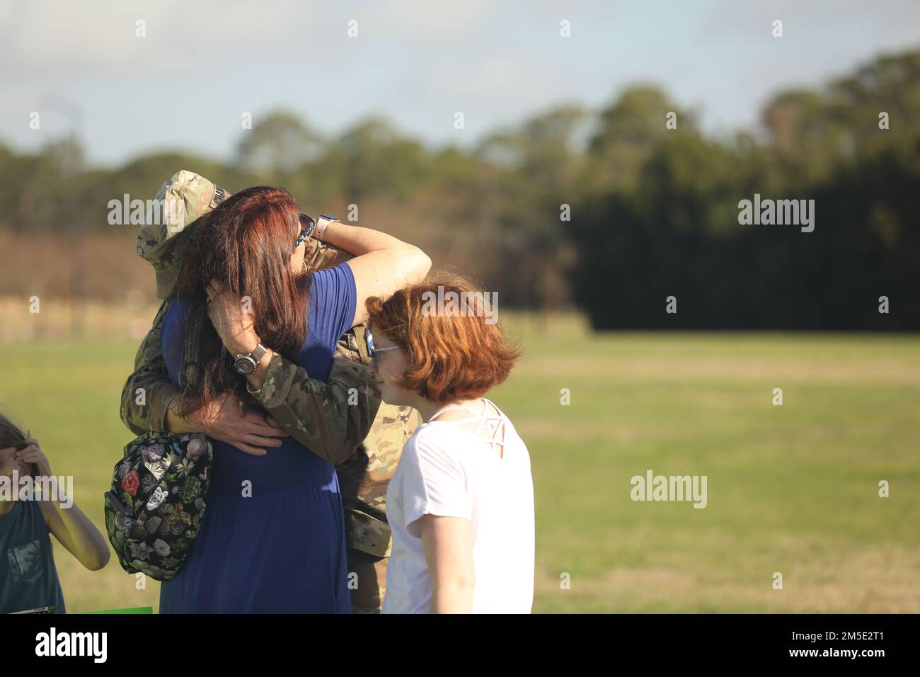 A 3rd Division Sustainment Brigade Soldier greets his family during a ...