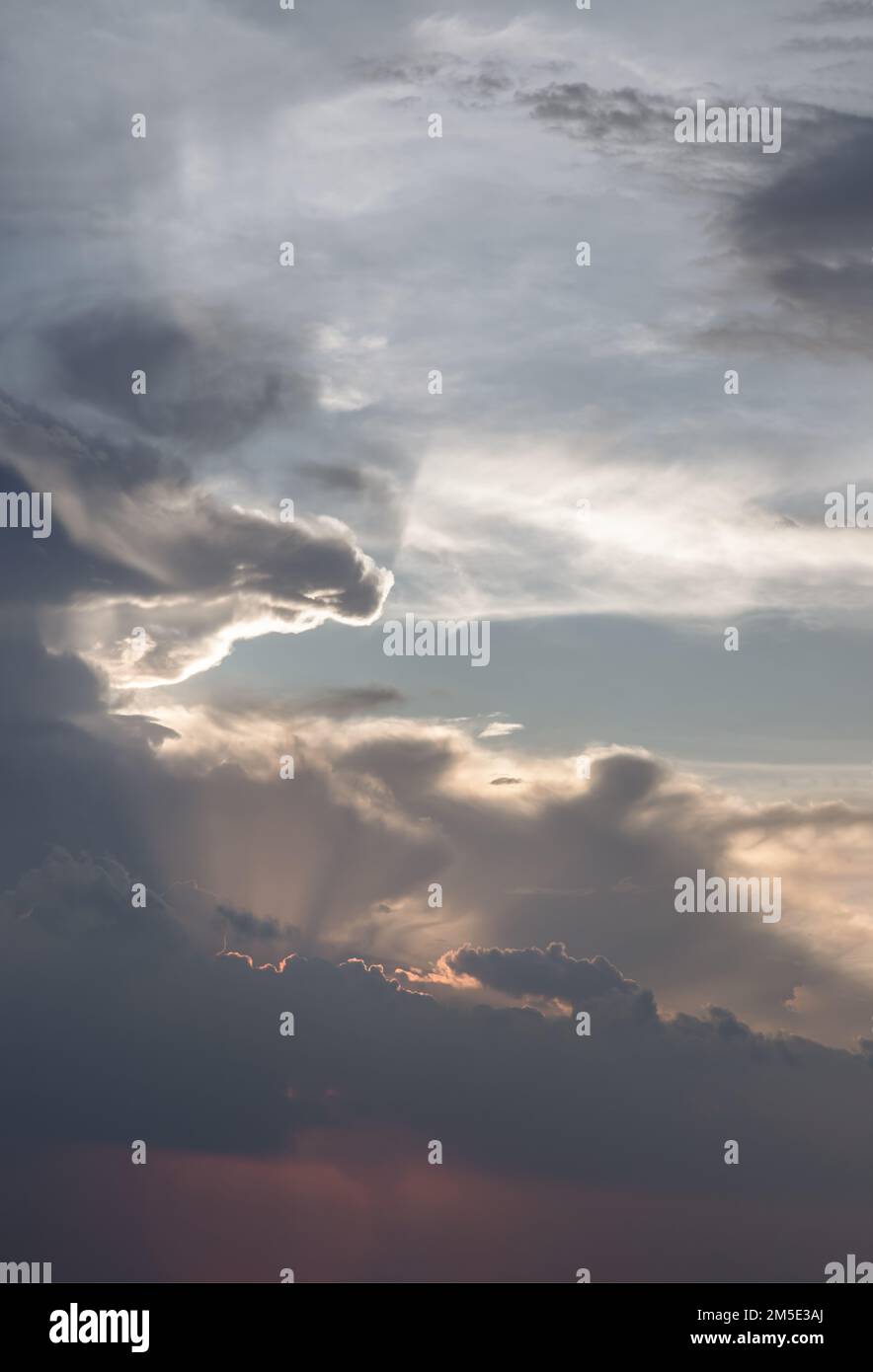 The sun's rays passing through the clouds and shining form an ...