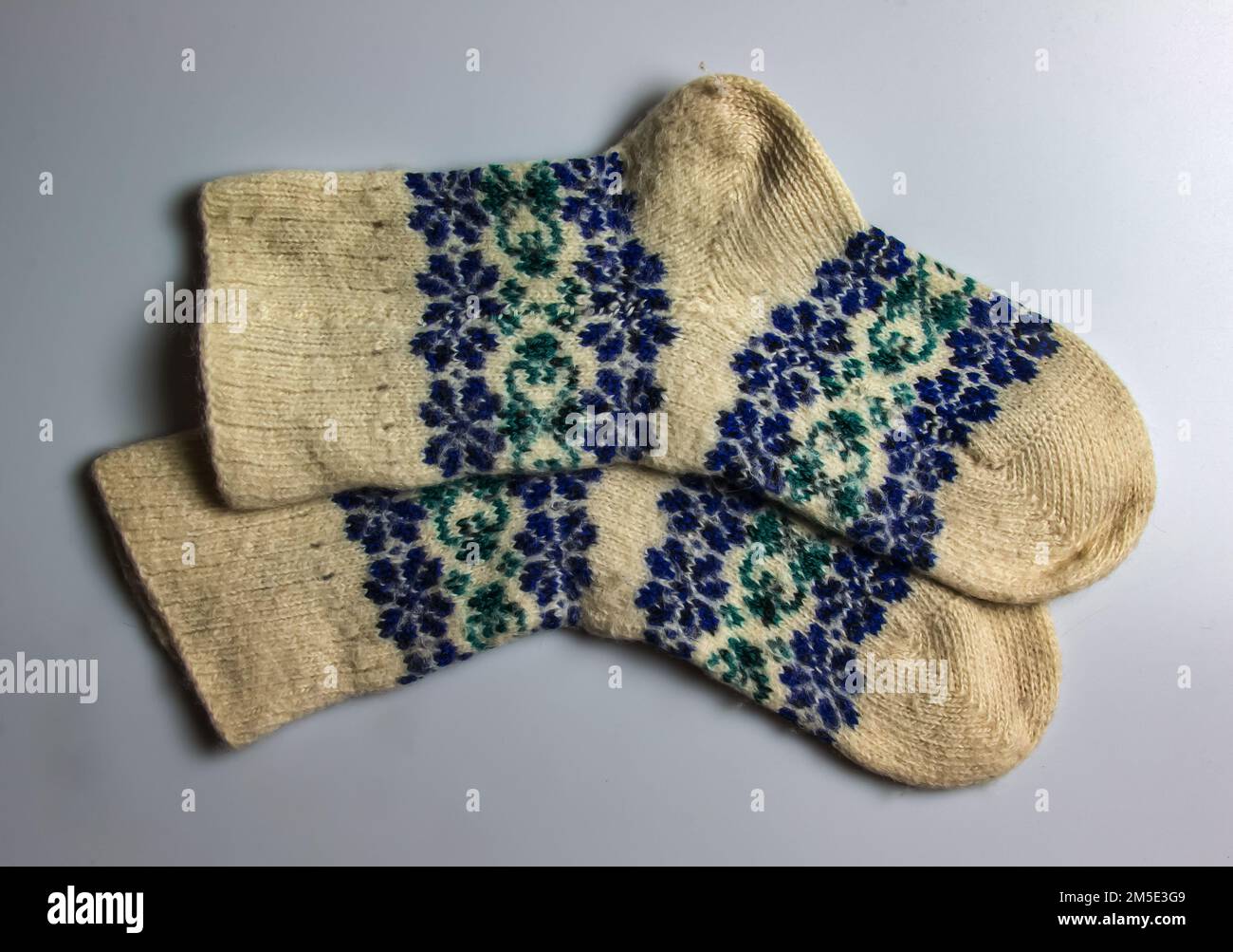 White wool socks with blue-green handmade Argentine merino wool on a ...
