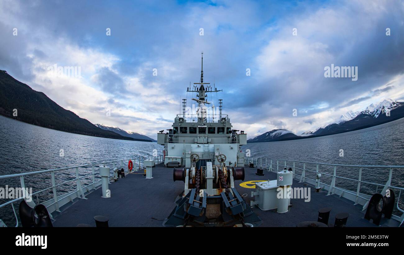 Her Majesty's Canadian Ship Brandon sails along the coastline of Alaska ...