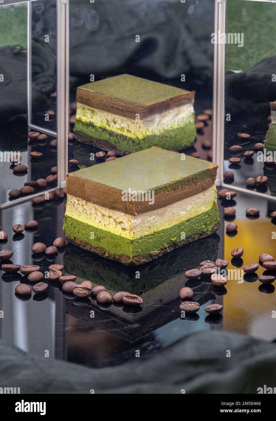 Homemade Dark Chocolate Matcha Cheesecake and roasted coffee beans with ...