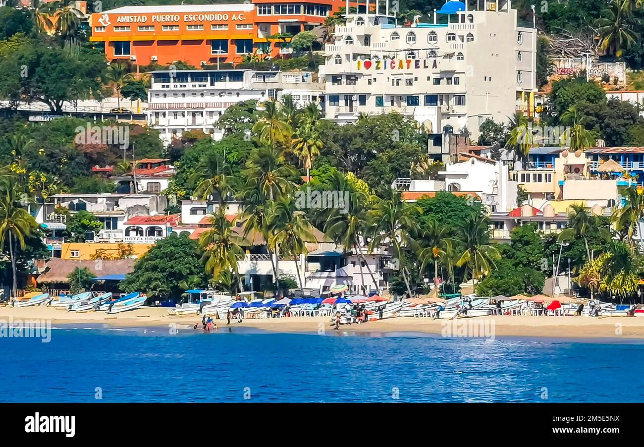 Sun beach people waves and boats in Zicatela Puerto Escondido Oaxaca ...