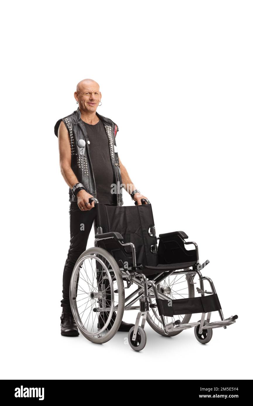 Punk standing behind a wheelchair isolated on white background Stock ...