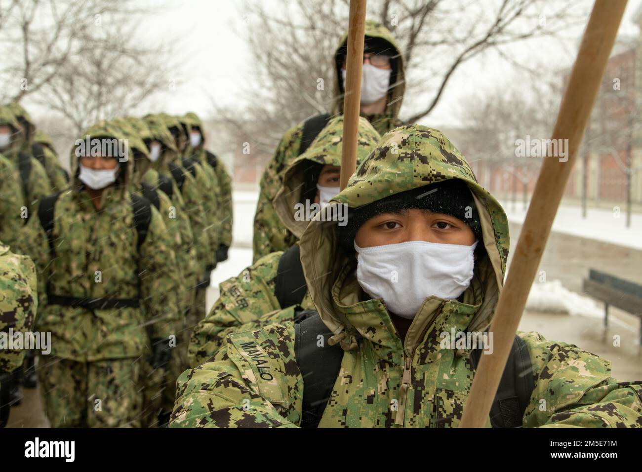 A recruit waits for instruction while her division reconfigures their ...