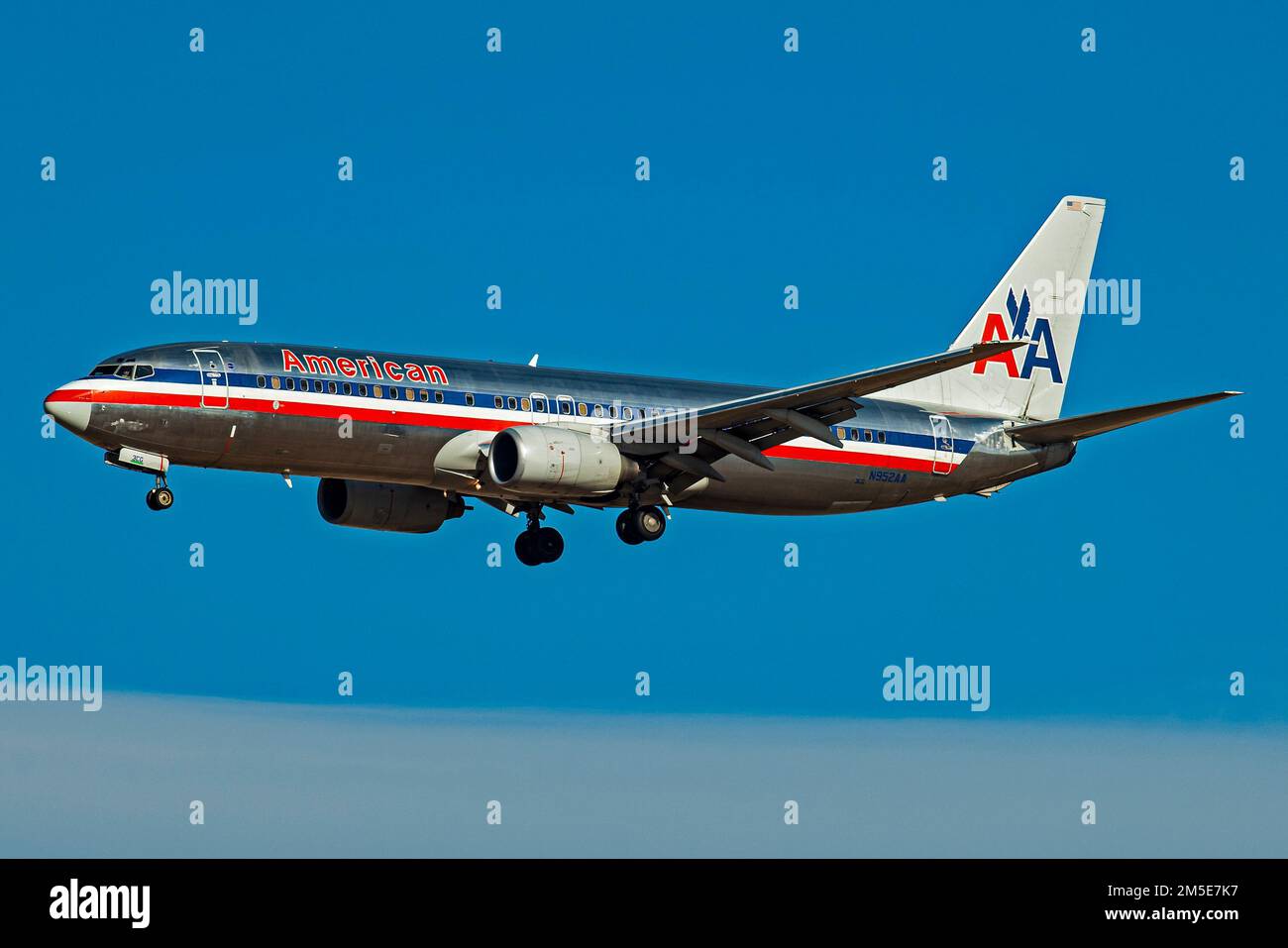 The American Airlines 737-800 N952AA plane in the blue sky Stock Photo ...