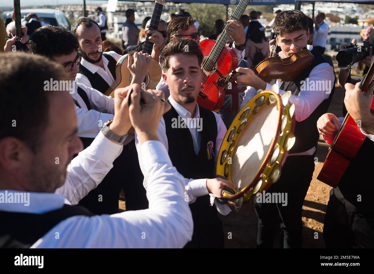 A group of participants dressed in traditional costumes are seen ...