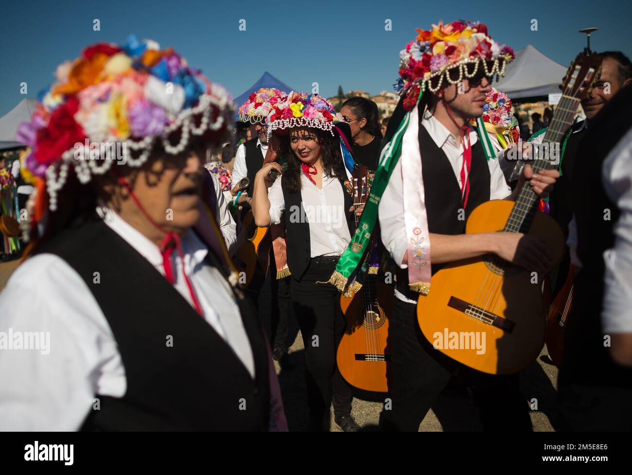 Participants dressed in traditional costumes are seen before taking ...