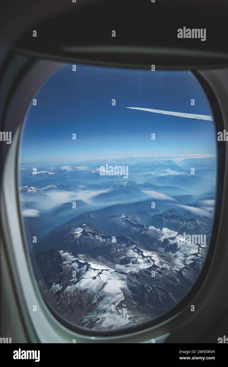 aerial view from airplane window on rocky mountains and river Stock ...