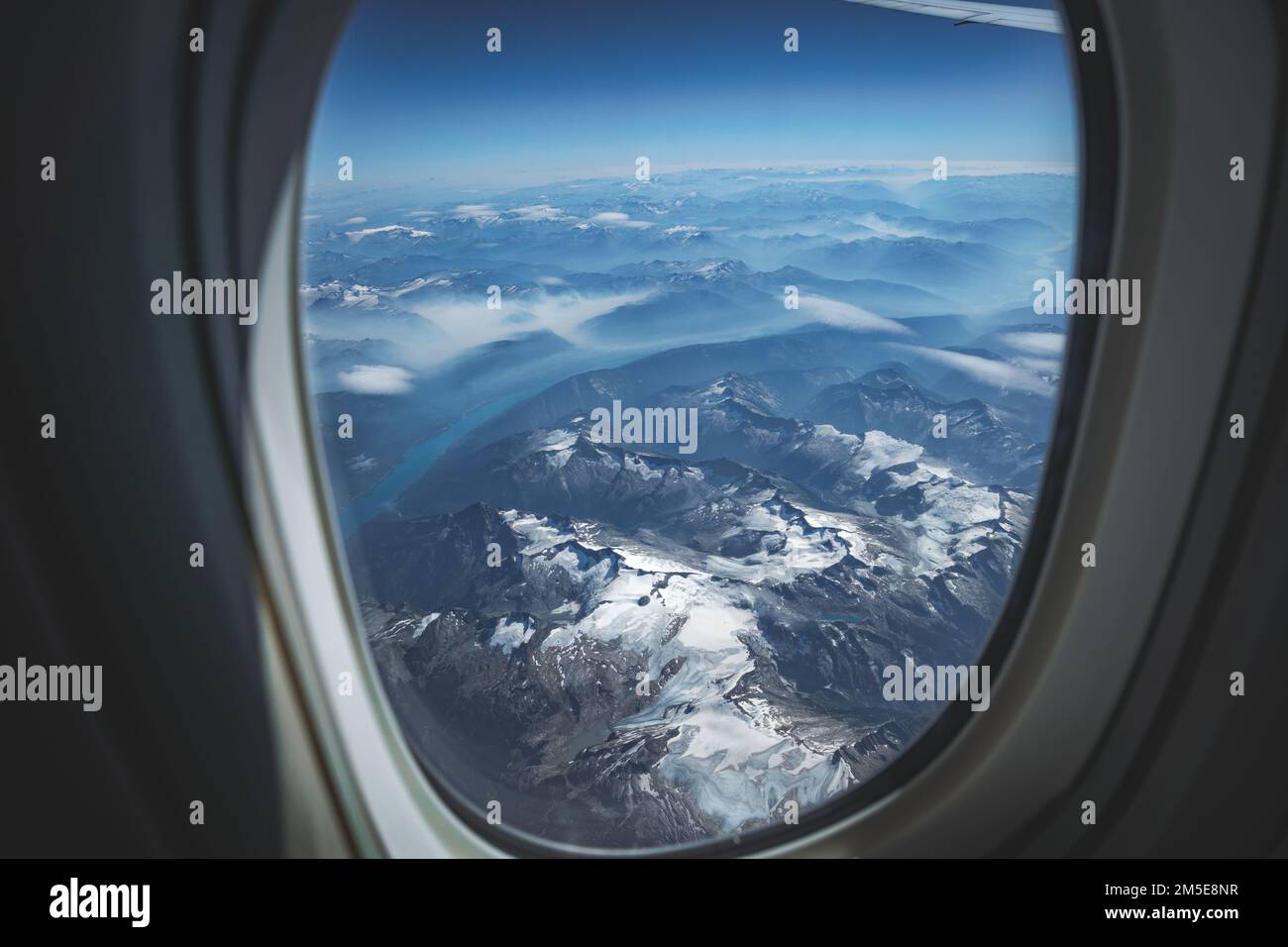 view from the plane window on mountain landscape Stock Photo - Alamy