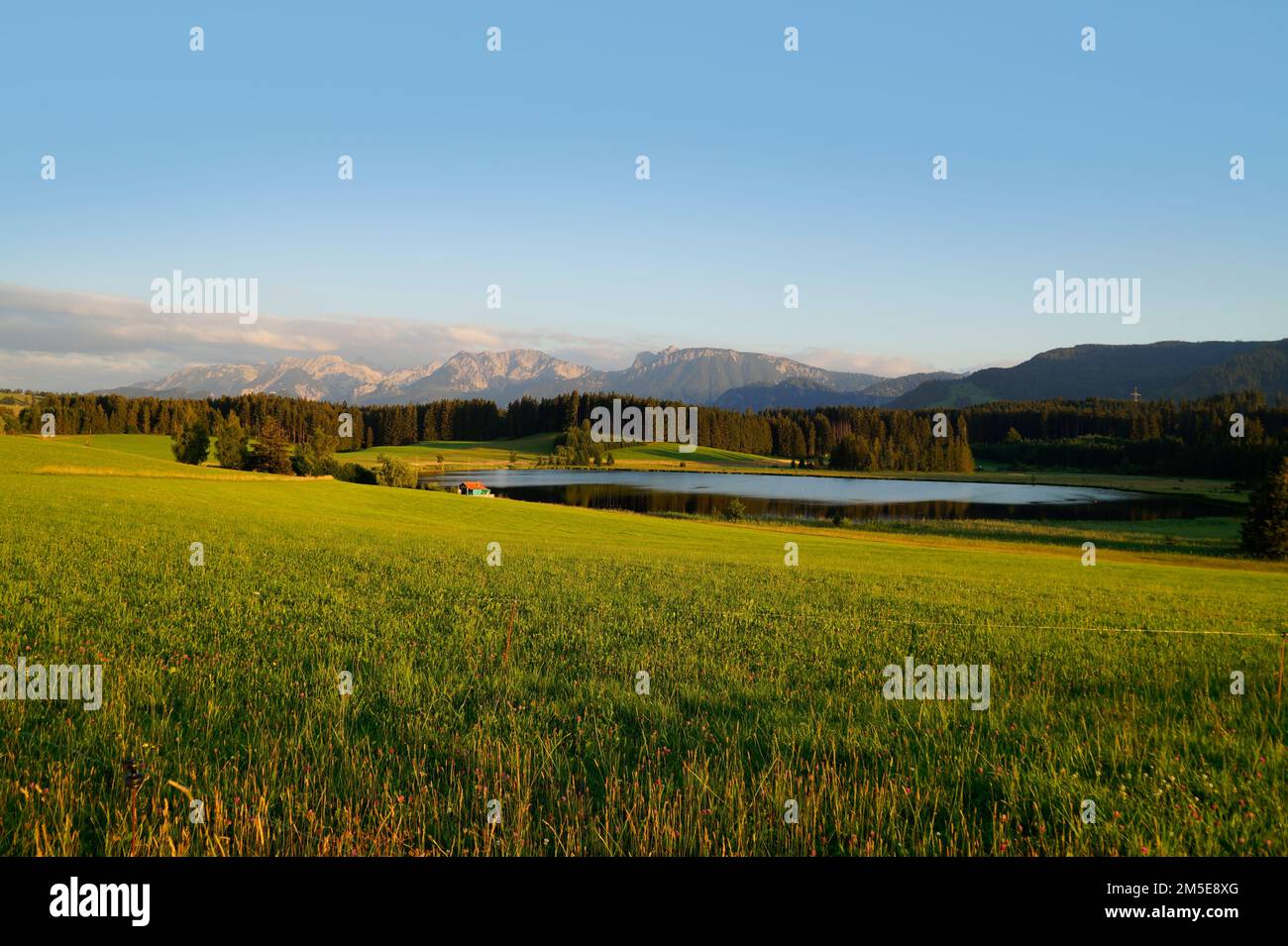 scenic alpine lake Attlesee and the lush alpine valley with its endless ...