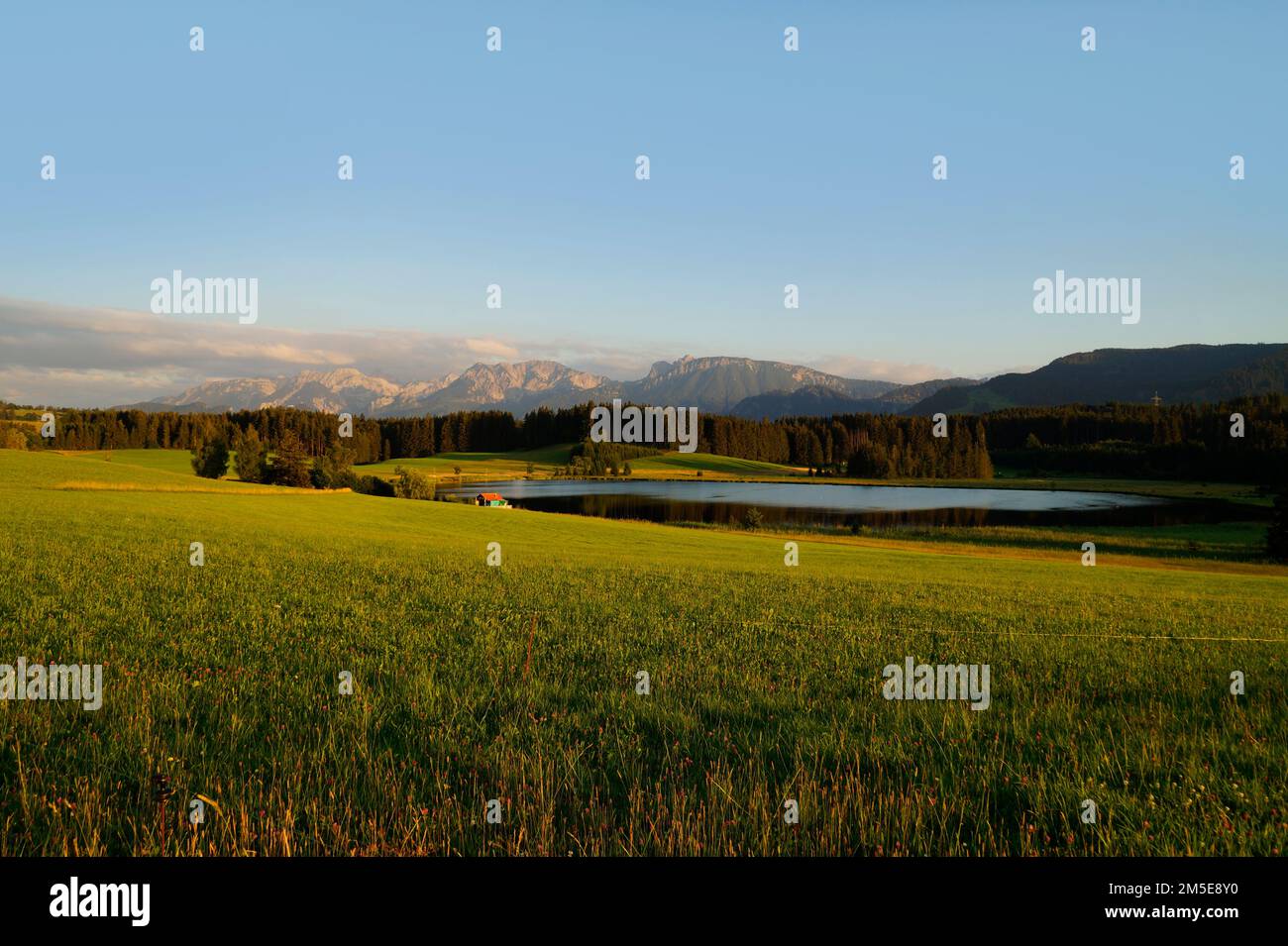 scenic alpine lake Attlesee and the lush alpine valley with its endless ...