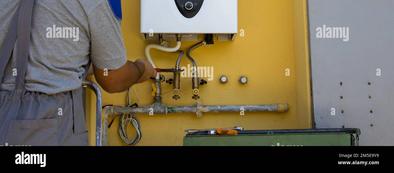Installing boiler hi-res stock photography and images - Alamy