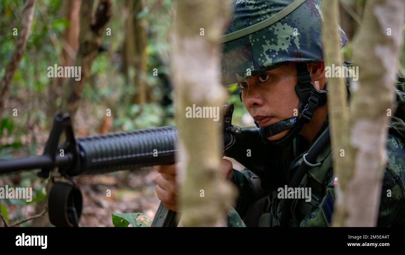A Royal Thai Army soldier secures the perimeter after a simulated ...