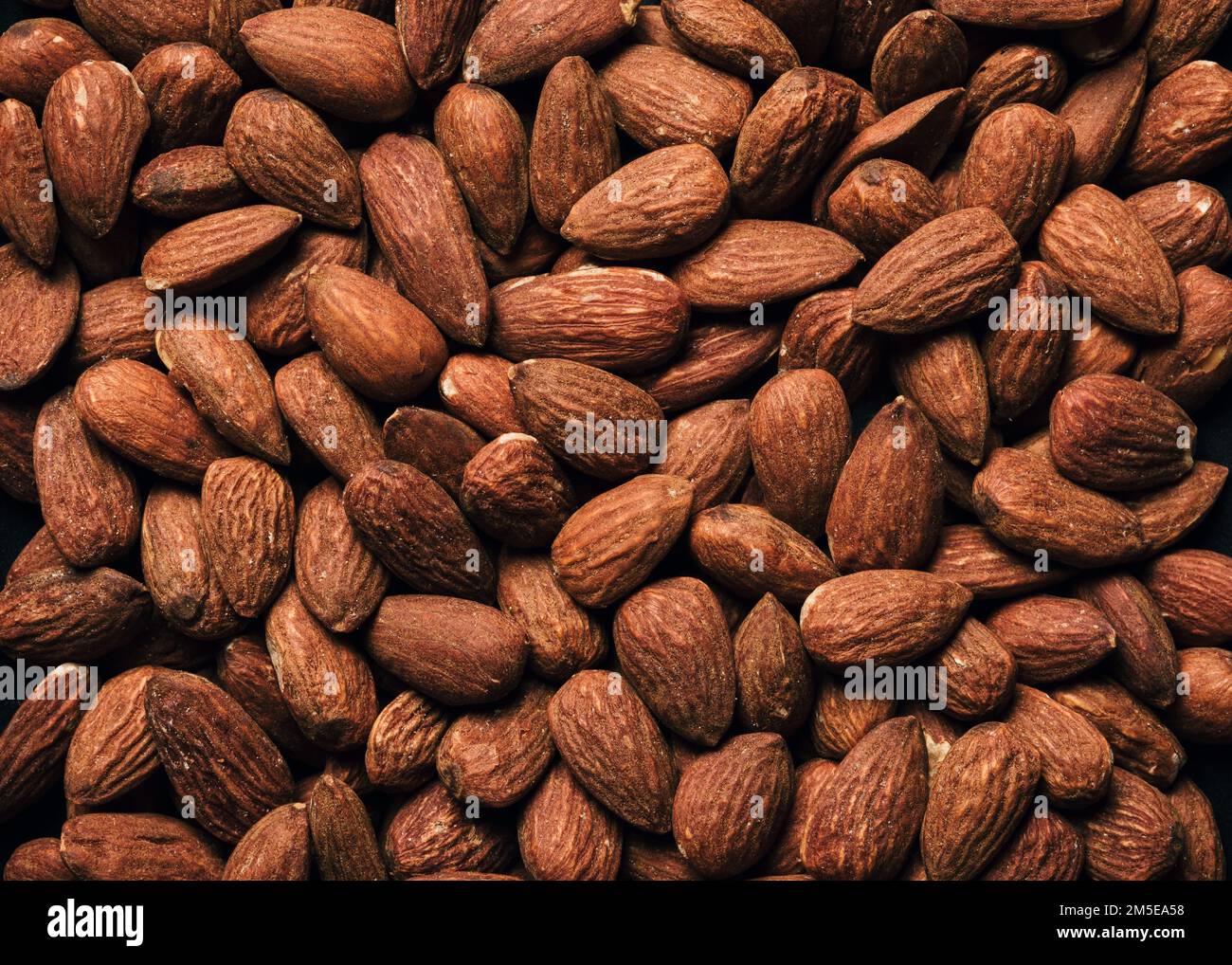 Roasted salted almonds closeup, background. Nuts texture Stock Photo ...